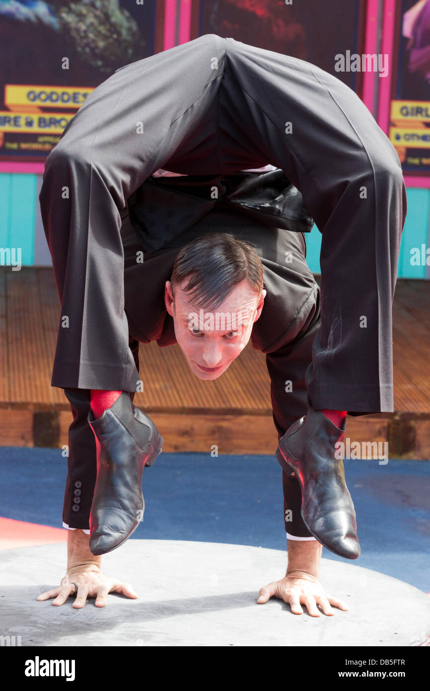 London, UK. 24 July 2013. Photo: Contortionist Jonathan Nosel of the ...