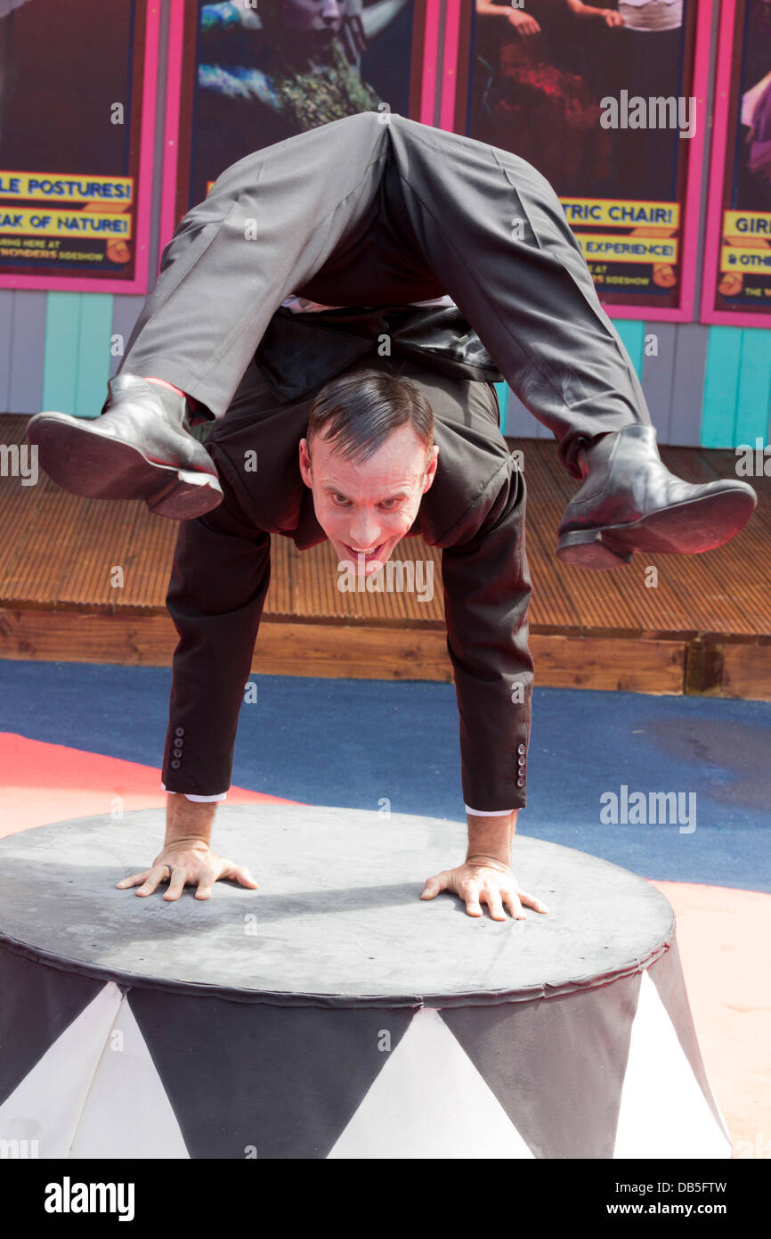 London, UK. 24 July 2013. Photo: Contortionist Jonathan Nosel of the ...