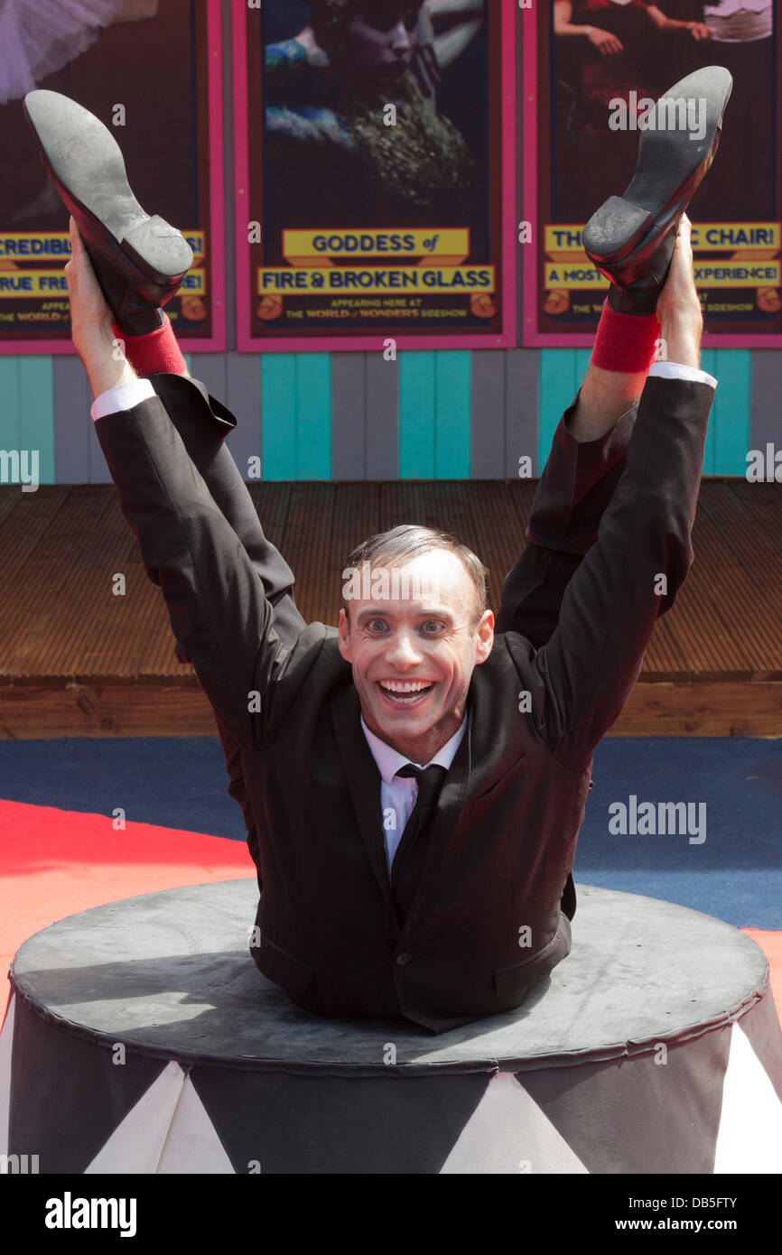 London, UK. 24 July 2013. Photo: Contortionist Jonathan Nosel of the ...