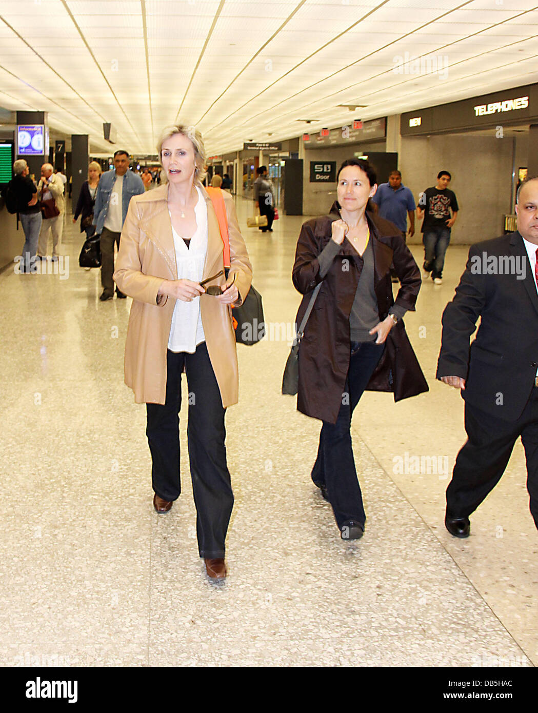 Jane Lynch and Dr. Lara Embry arriving at Washington Dulles Airport ...