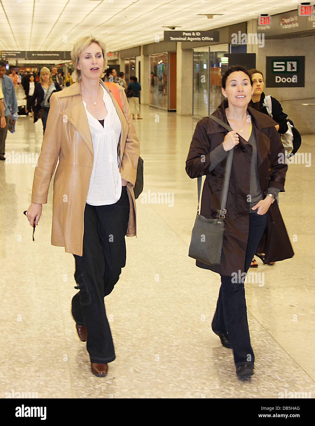 Jane Lynch and Dr. Lara Embry arriving at Washington Dulles Airport ...