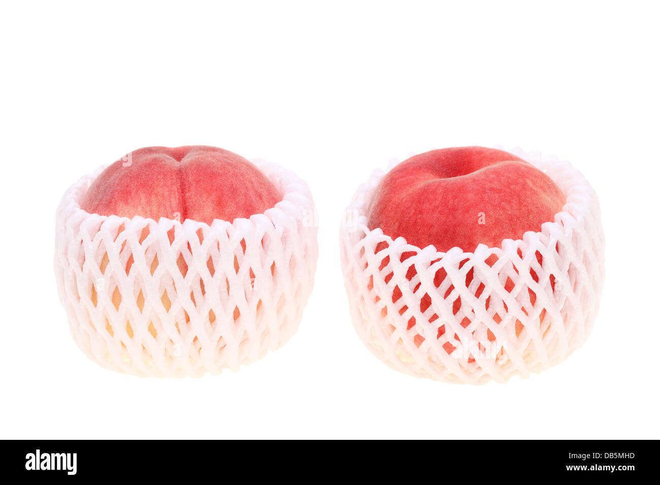 fresh peaches in protection net Stock Photo - Alamy