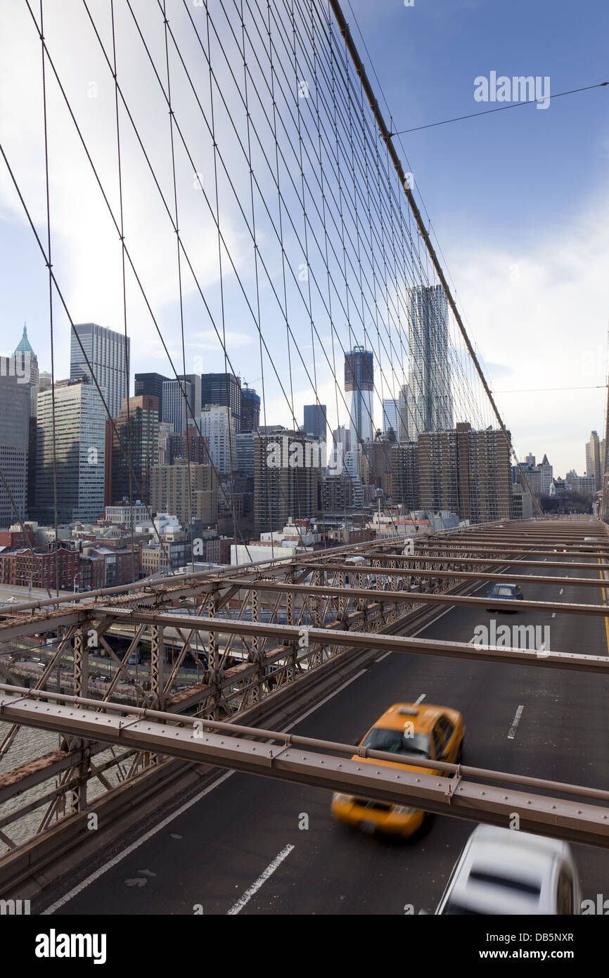Cars driving on the New York City Brooklyn Bridge in Manhattan with ...