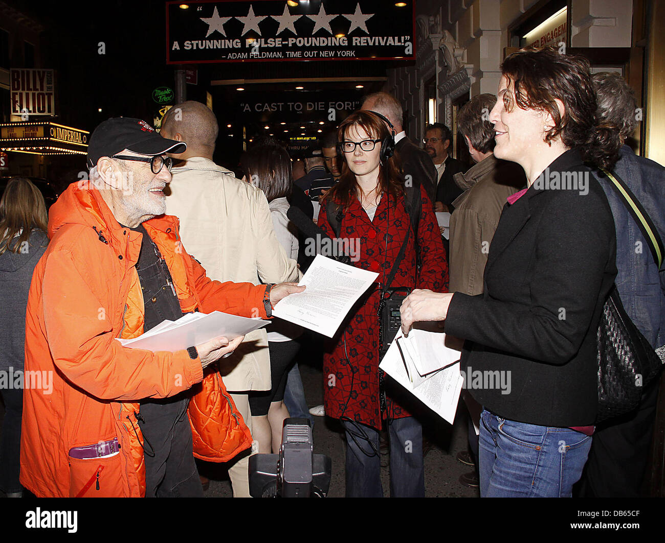 Larry Kramer handing out fliers about AIDS to audience members after a ...