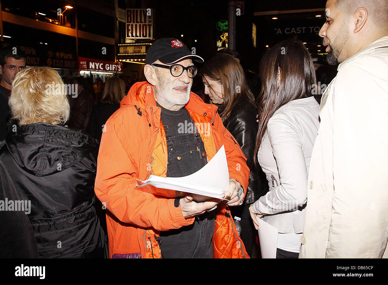 Larry Kramer handing out fliers about AIDS to audience members after a ...