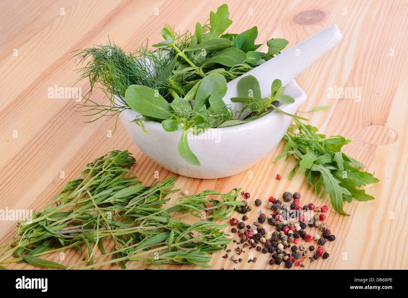 Mortar with color peppercorn, fresh corn salad, arugula, thyme ...