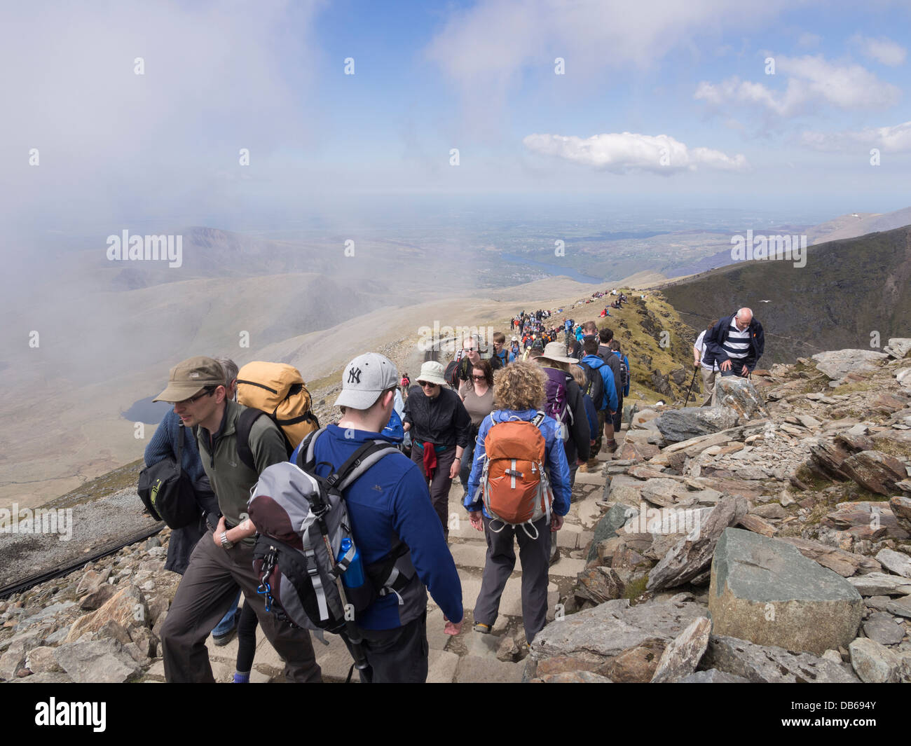 Crowds of people walking on Mt Snowdon summit on a busy summer weekend ...