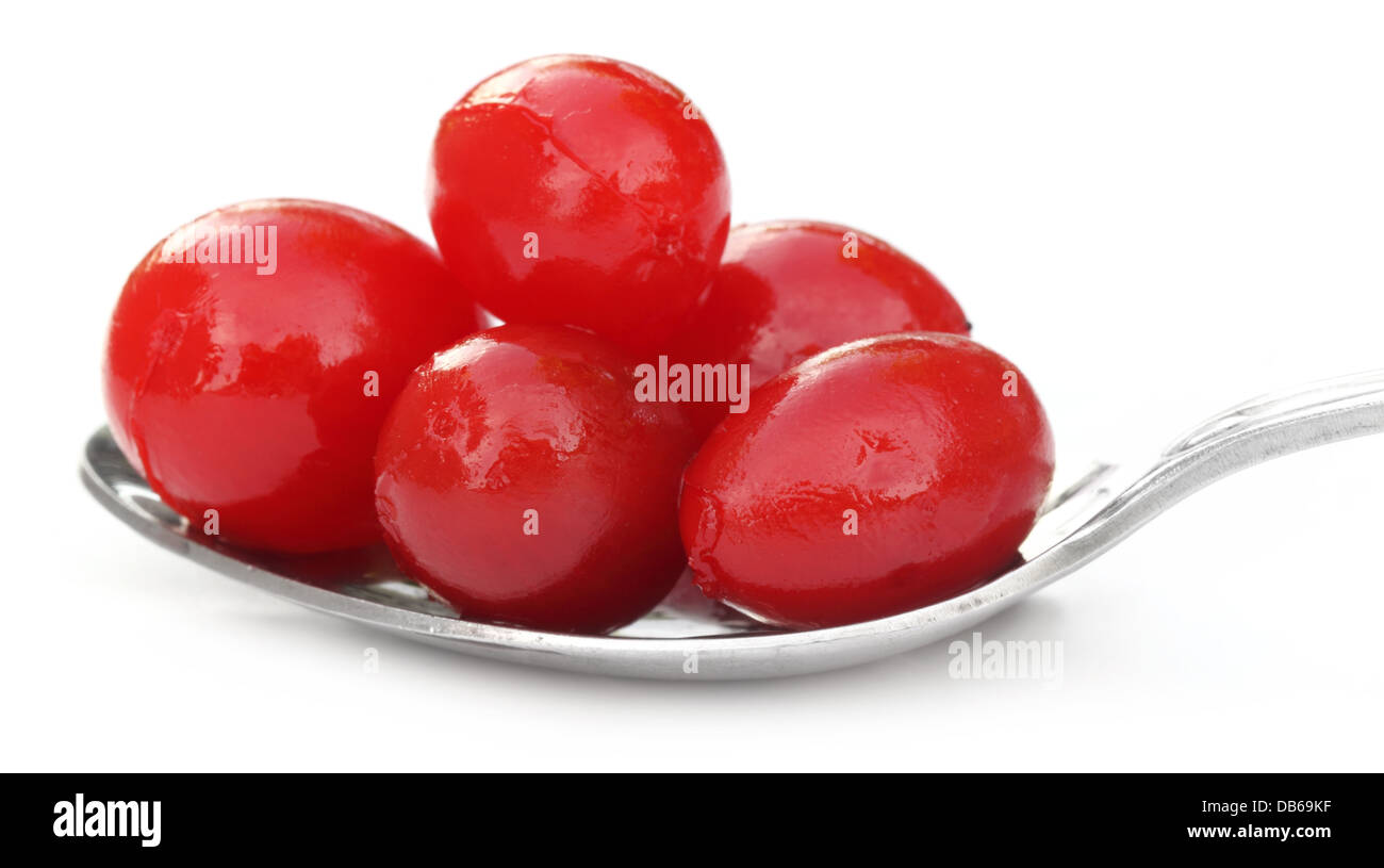 Processed cherry on a silver spoon Stock Photo - Alamy