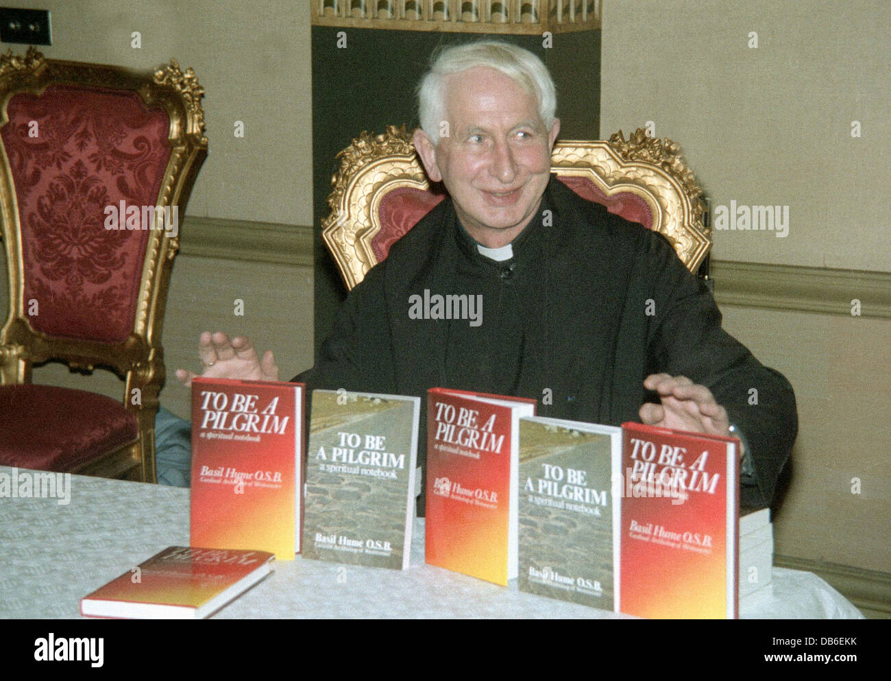 Cardinal Hume of Westminster London UK with his book To be a Pilgrim ...