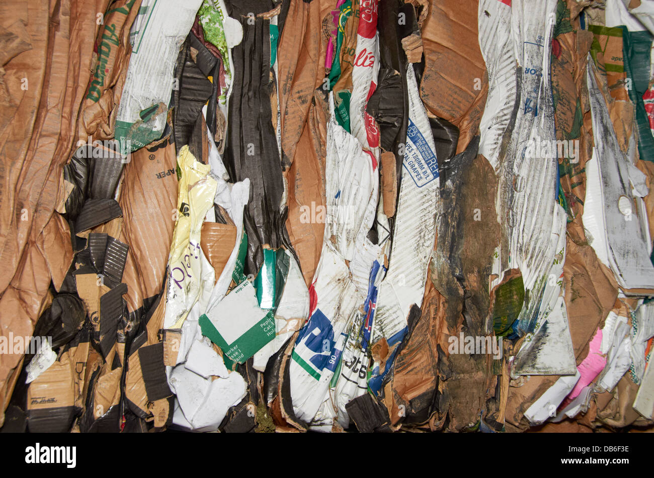 Cardboard that has been compacted in a baling machine Stock Photo - Alamy