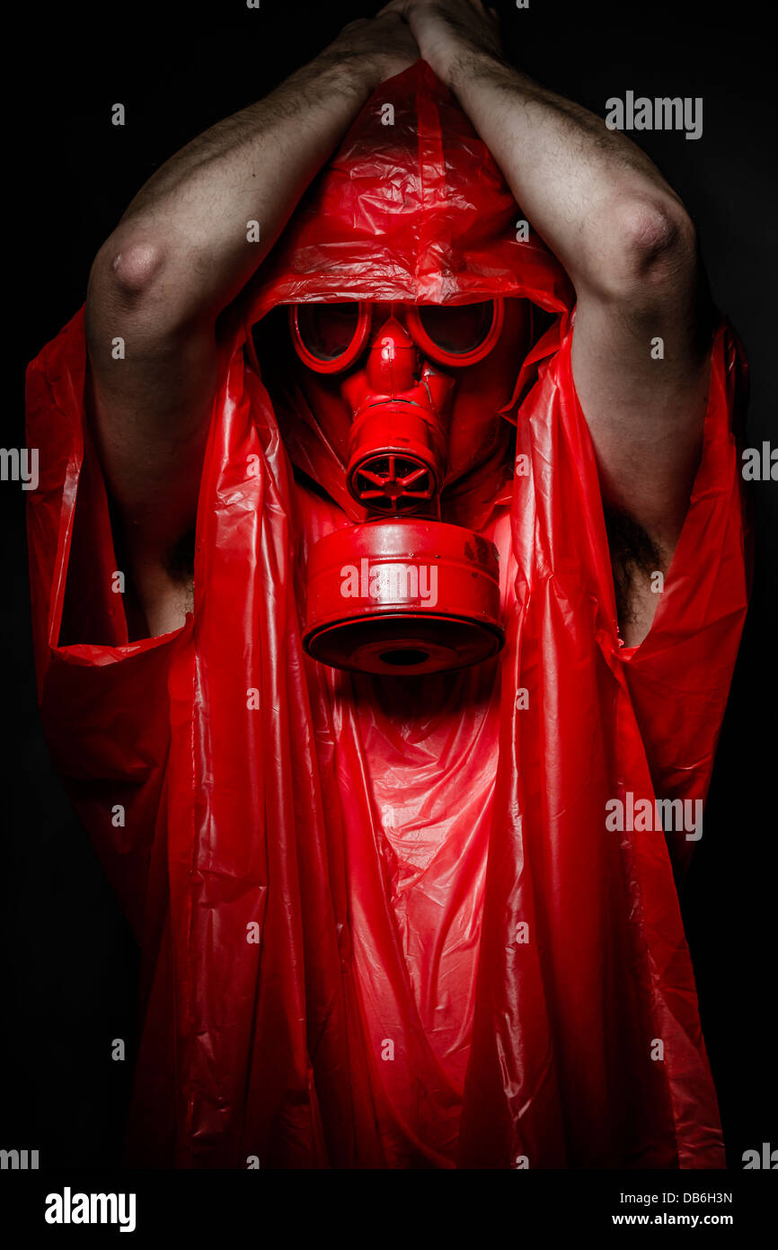 Biohazard concept, man with red gas mask Stock Photo - Alamy