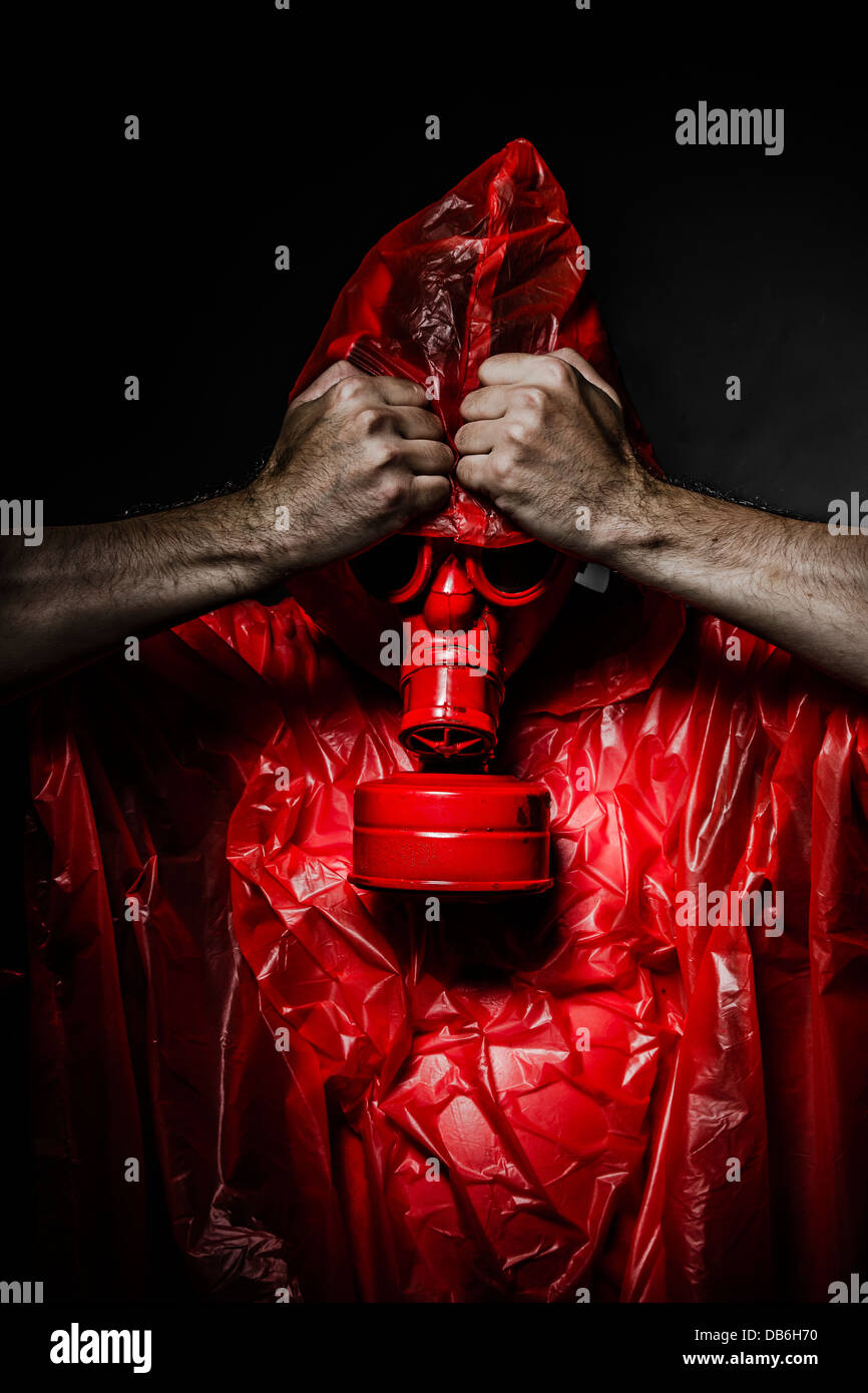 Toxic concept, man with red gas mask Stock Photo - Alamy