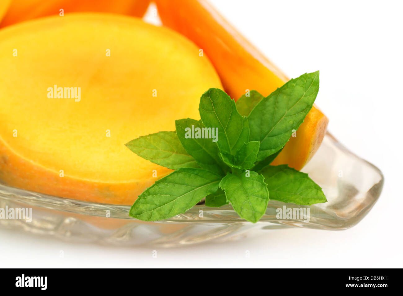Fresh sliced Mango with mint Stock Photo - Alamy