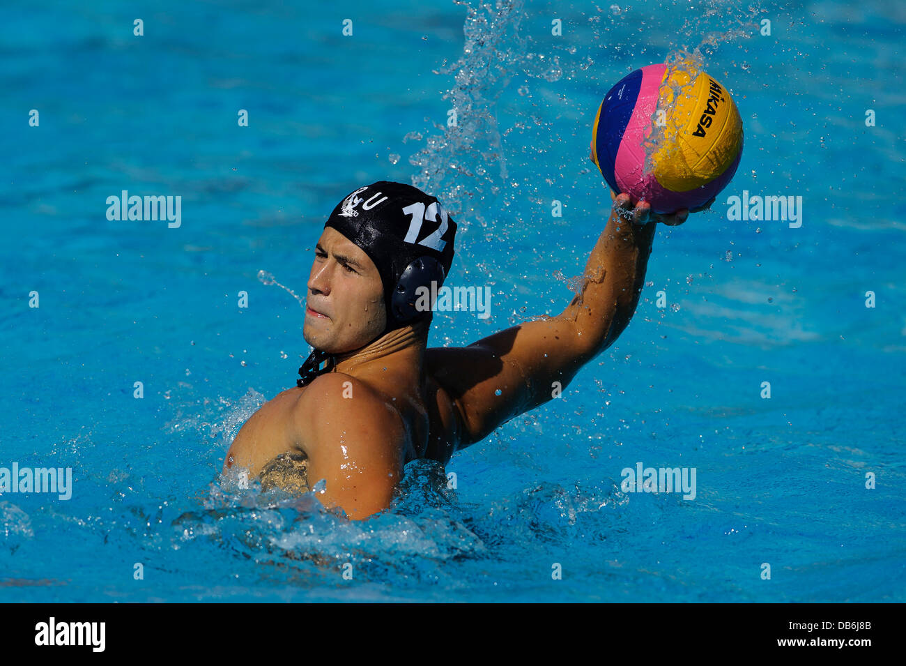 Barcelona, Spain. 24th July, 2013. Andrei Cretu (#12 blue cap) of Romania (ROU) in action during ...