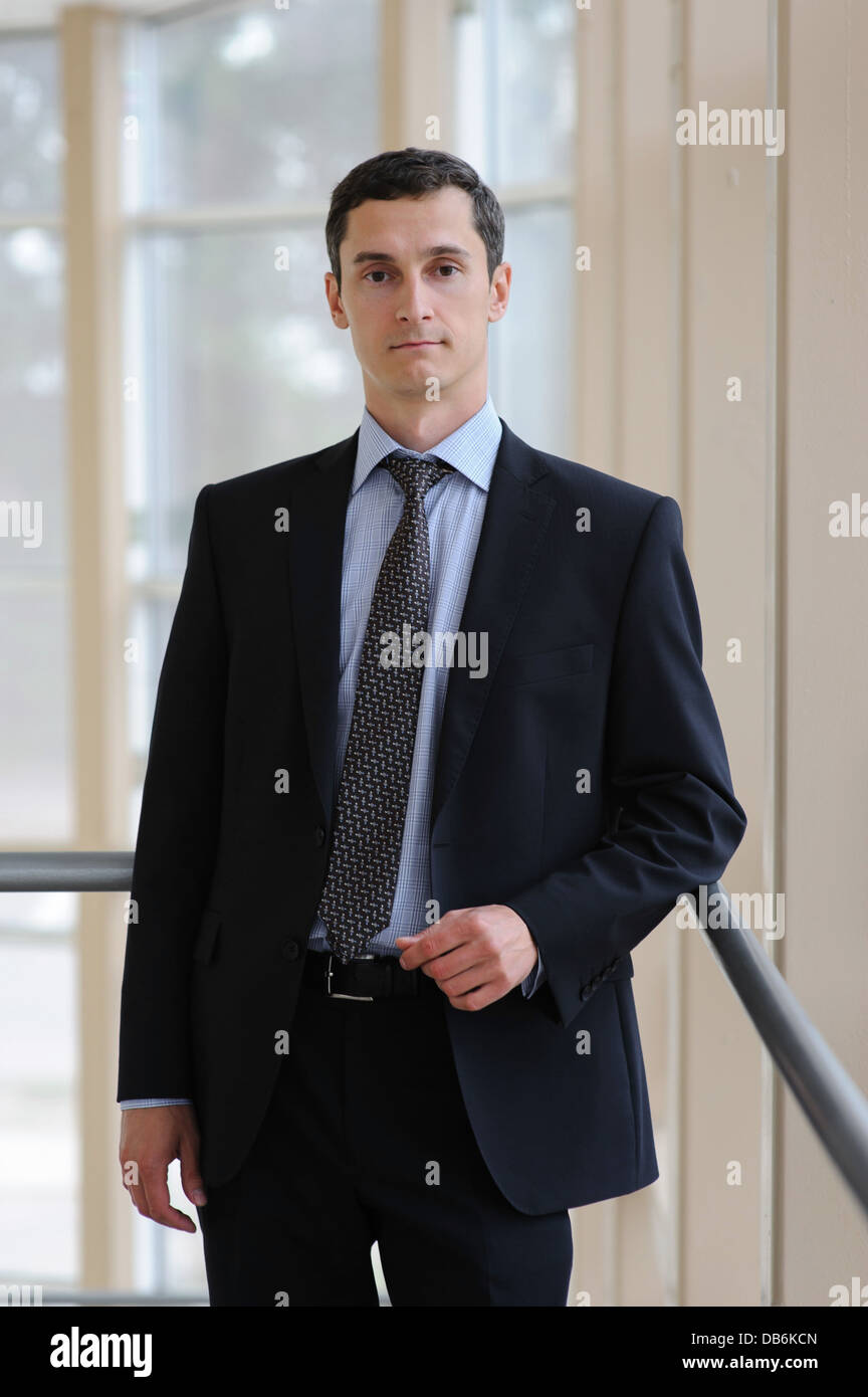 Portrait of young manager in black jacket Stock Photo - Alamy
