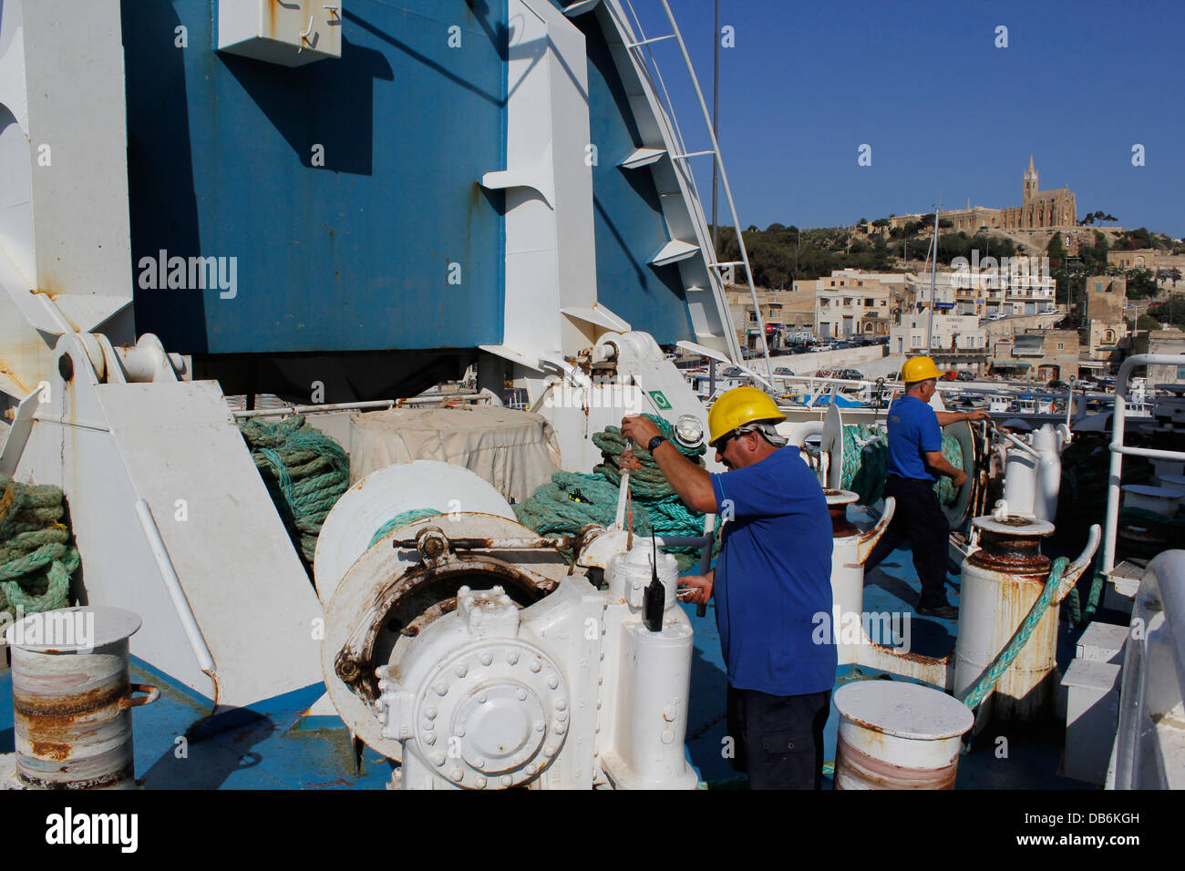 Crew at work in a ferry in the harbour off Mgarr in the island of Gozo ...