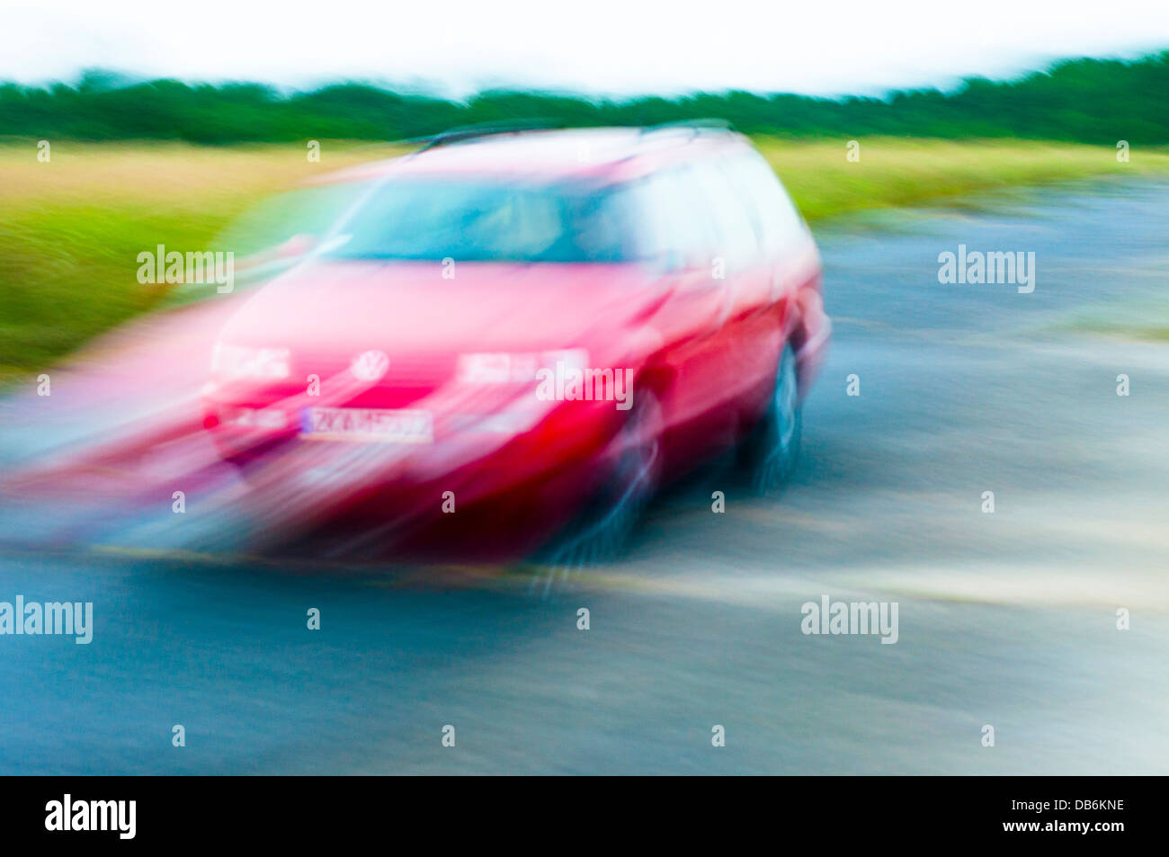 An abstract image of drunk driver driving red car Stock Photo - Alamy