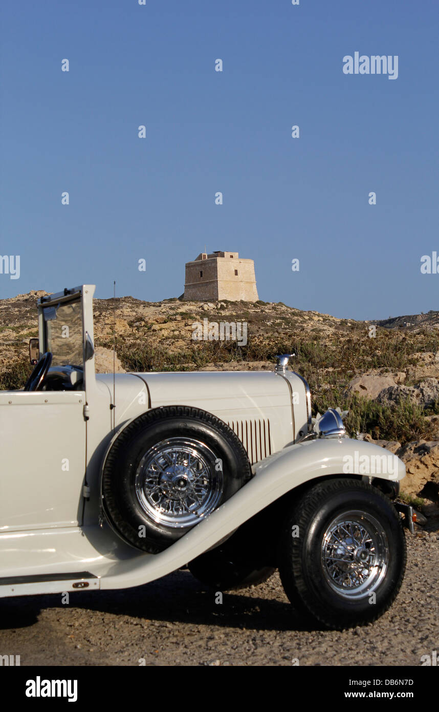 View across a 1930 Ford Model DeLuxe Limo toward Img Dwejra Tower ...