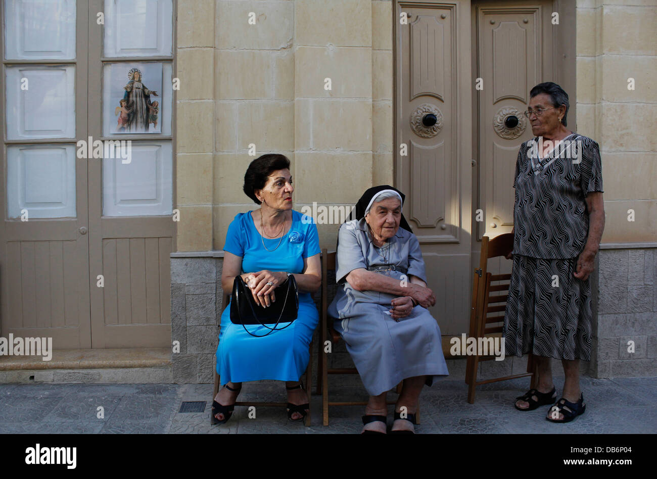 Elderly residents of the village of Kercem in the island of Gozo, the ...
