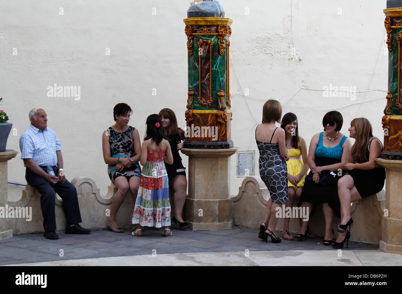 Local residents of the village of Kercem in the island of Gozo, the ...