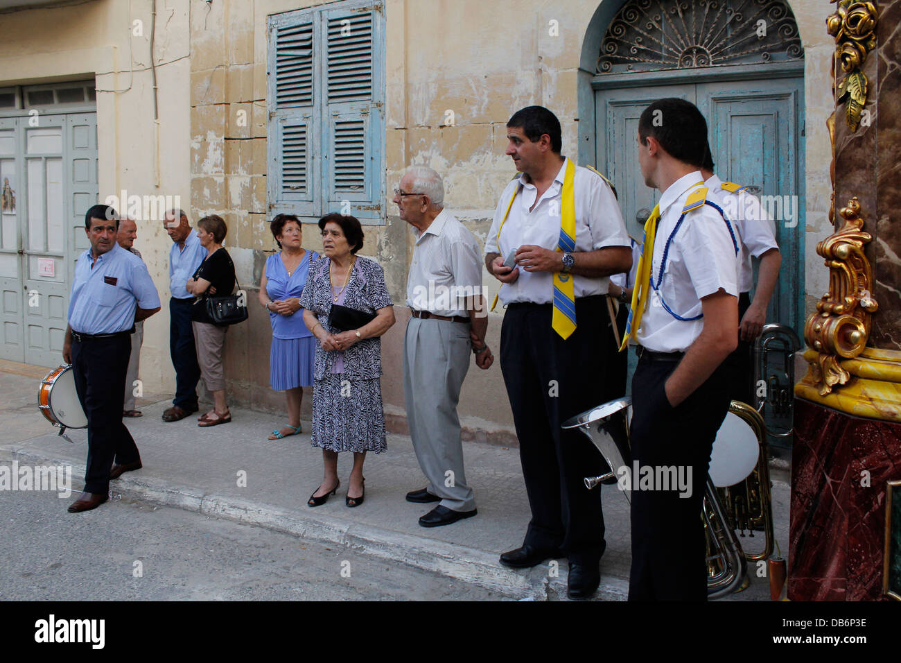 Local residents of the village of Kercem in the island of Gozo, the ...