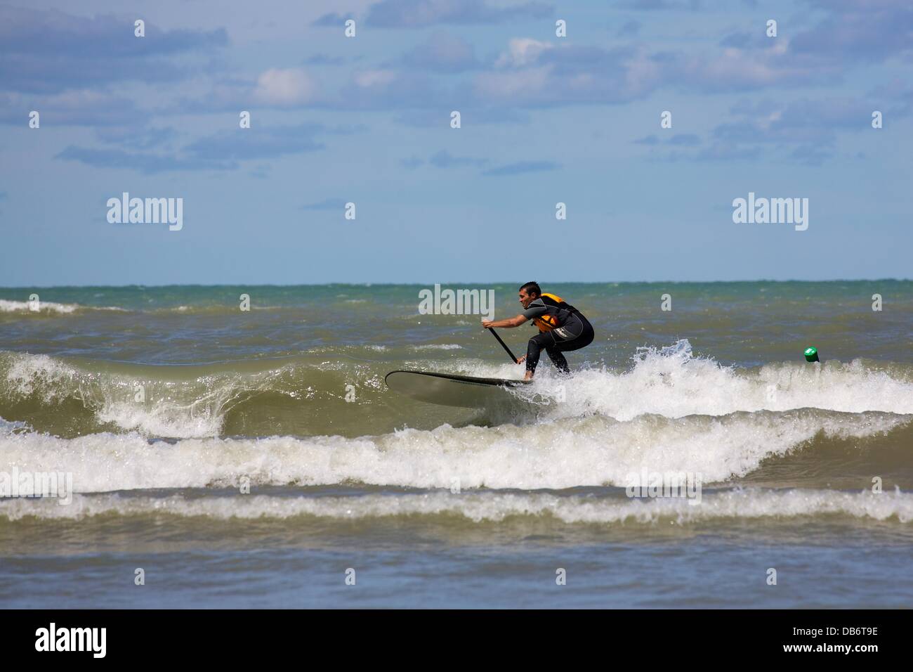 Chicago, Illinois, USA. 24th August, 2013. A man on a standup paddle ...