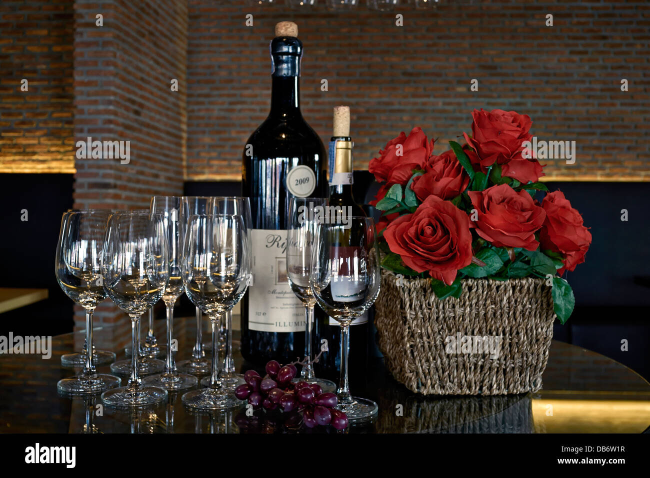 Wine bar display featuring bottles of wines, polished glasses and a ...