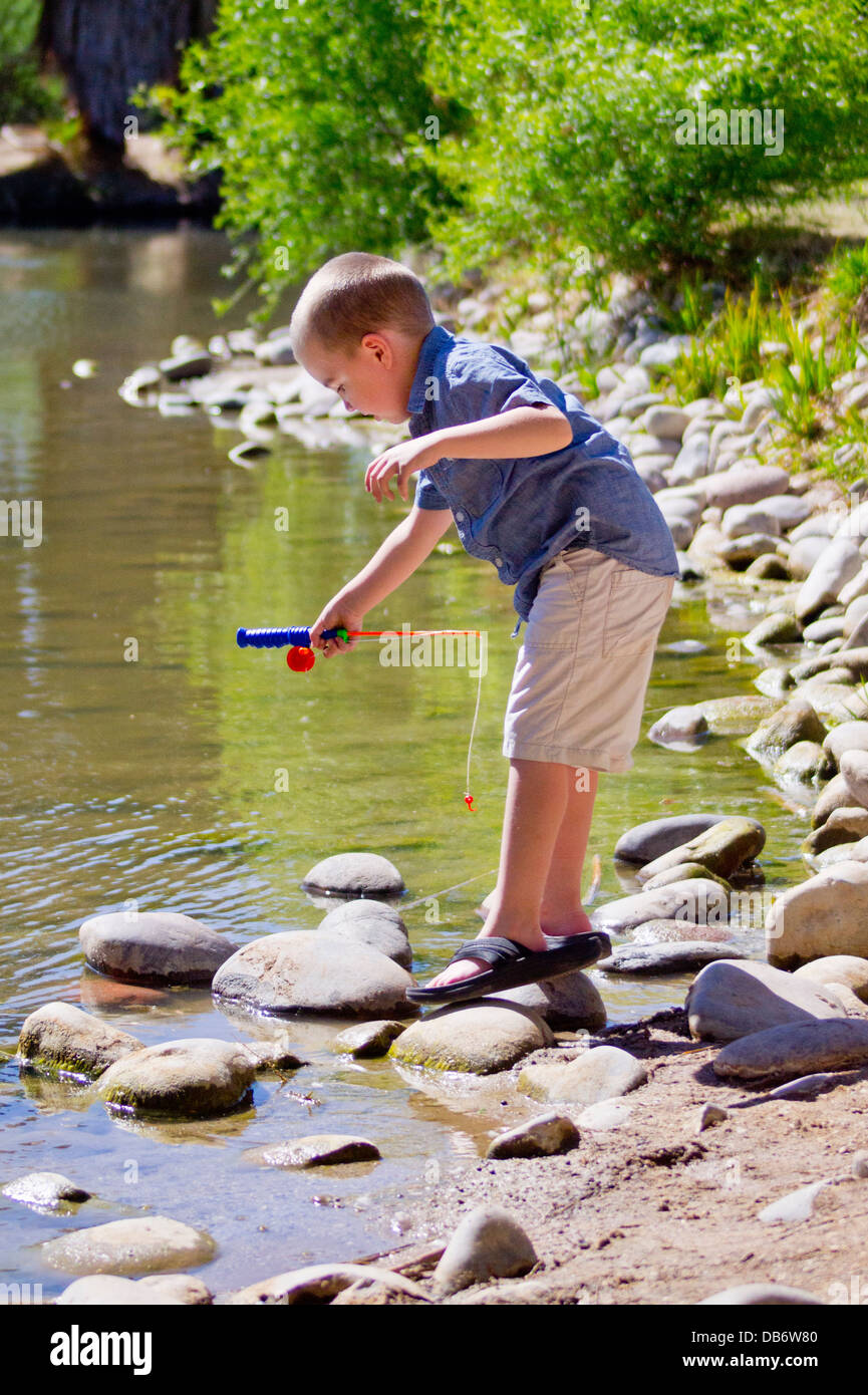 A fiver year old boy with autism goes "fishing Stock Photo - Alamy