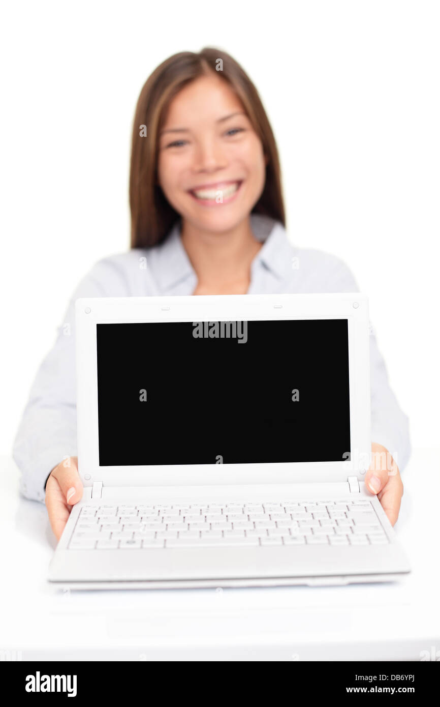 Laptop computer - woman showing screen smiling happy. Focus on pc ...