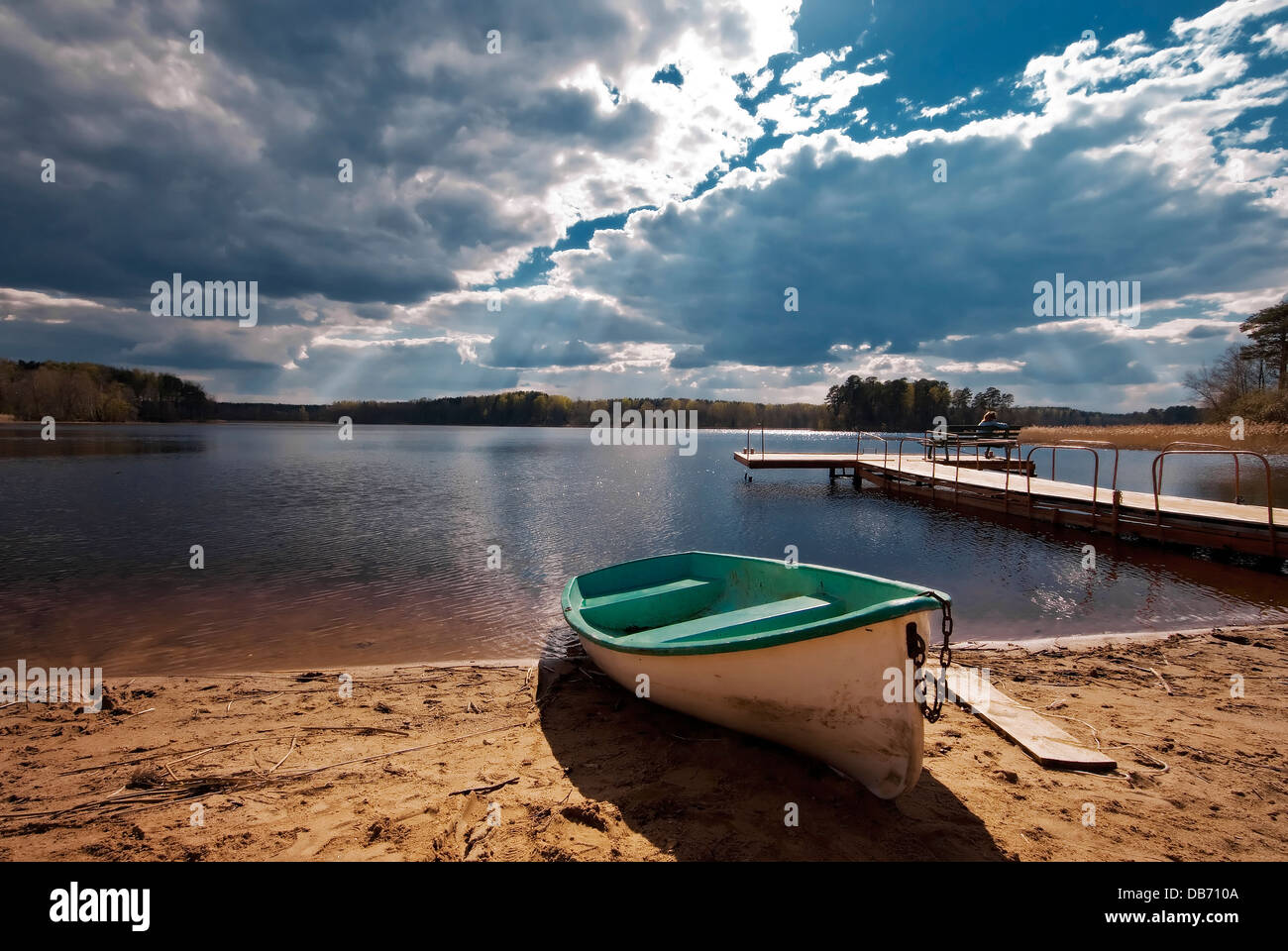Boat on the beach, bad weather Stock Photo - Alamy
