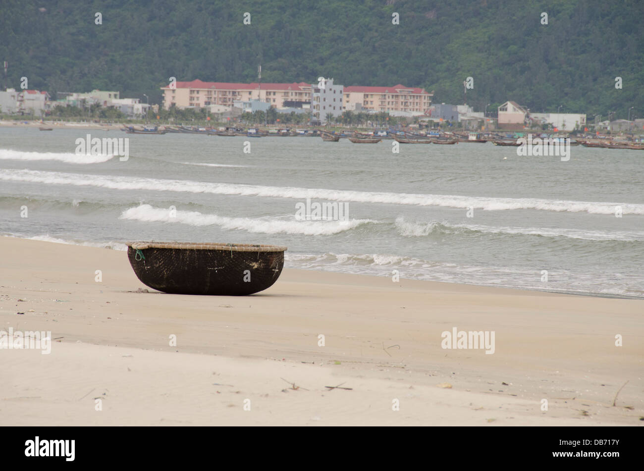 Vietnam, Da Nang. Bac My An beach, traditional tiny round bamboo ...