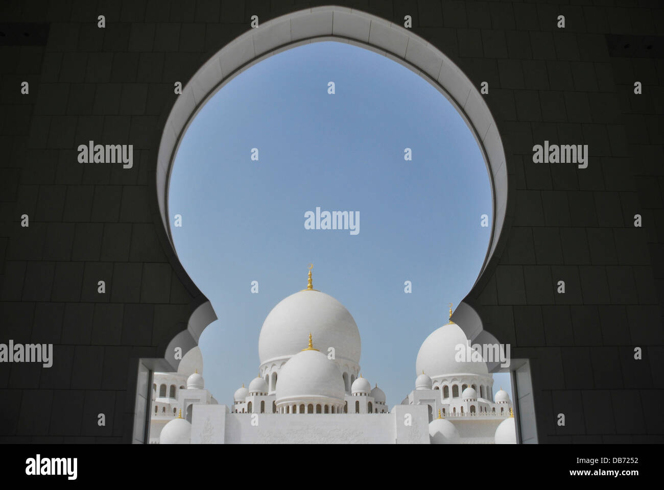 Domes through Arabian arch Stock Photo - Alamy