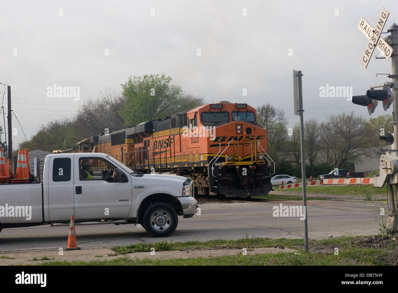 General Electric GEVO locomotive leads a BNSF freight train across a ...