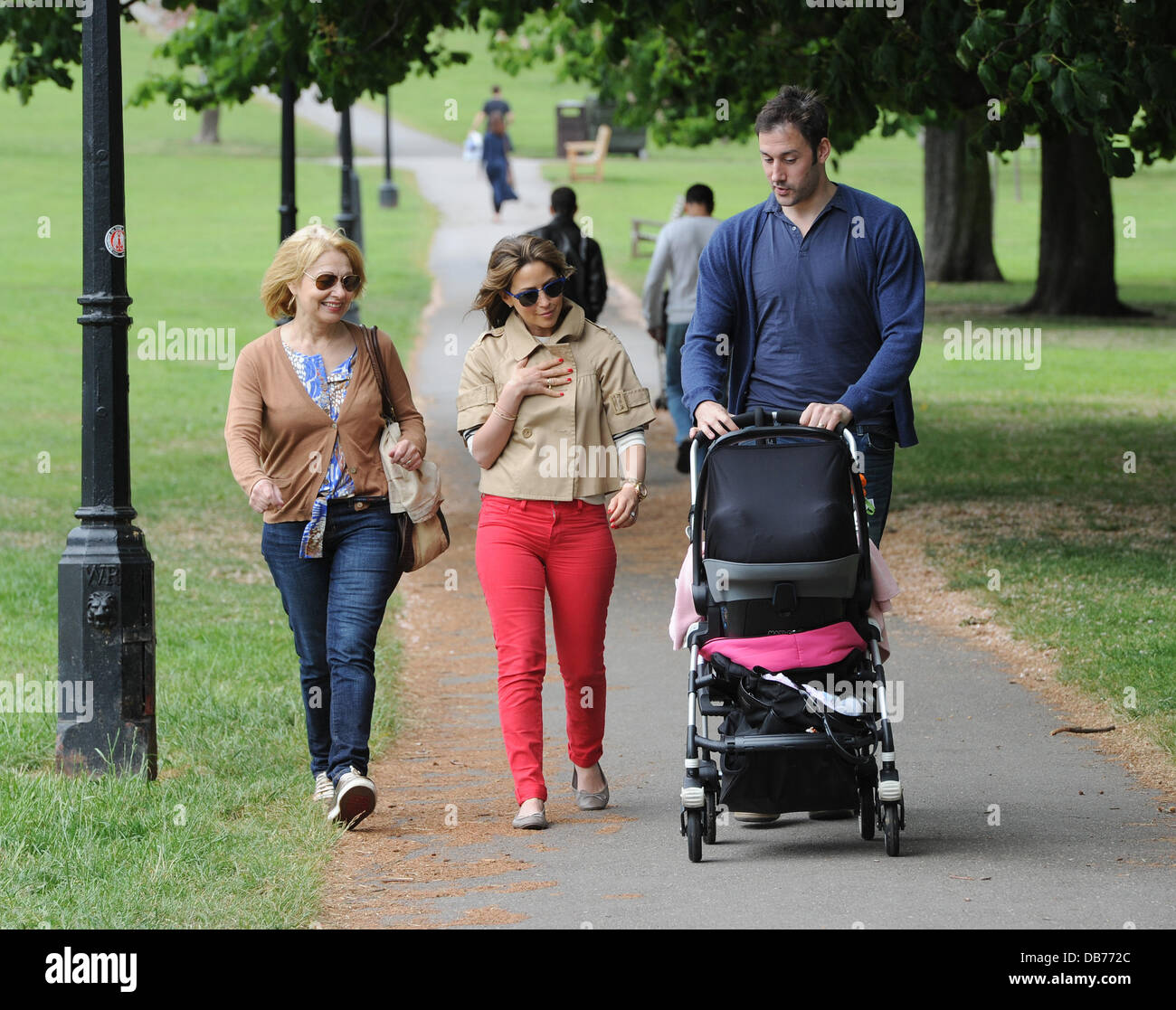 Rachel Stevens and her husband Alex Bourne take their baby for a walk ...