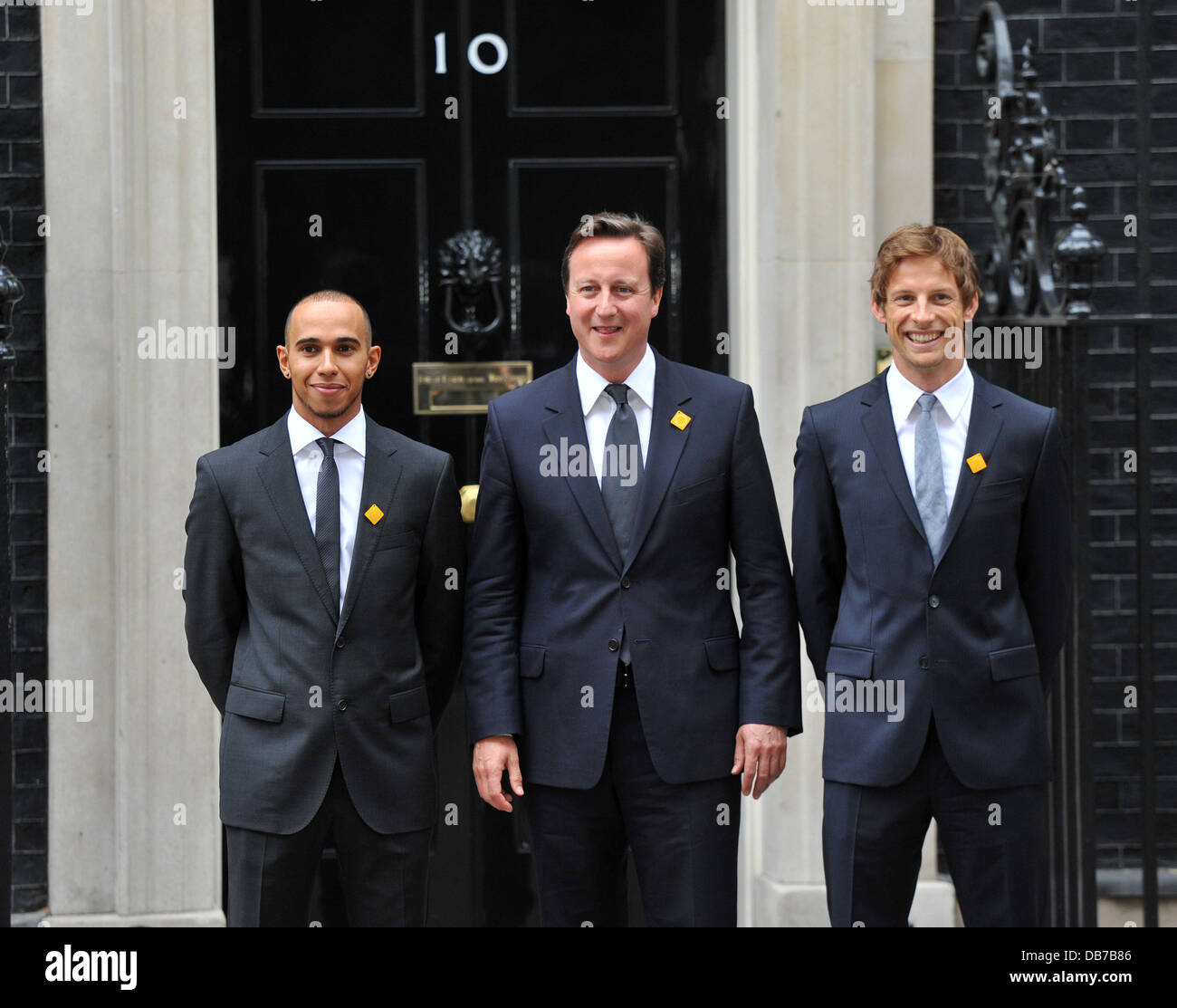 Prime Minister David Cameron, Jenson Button and Lewis Hamilton are ...