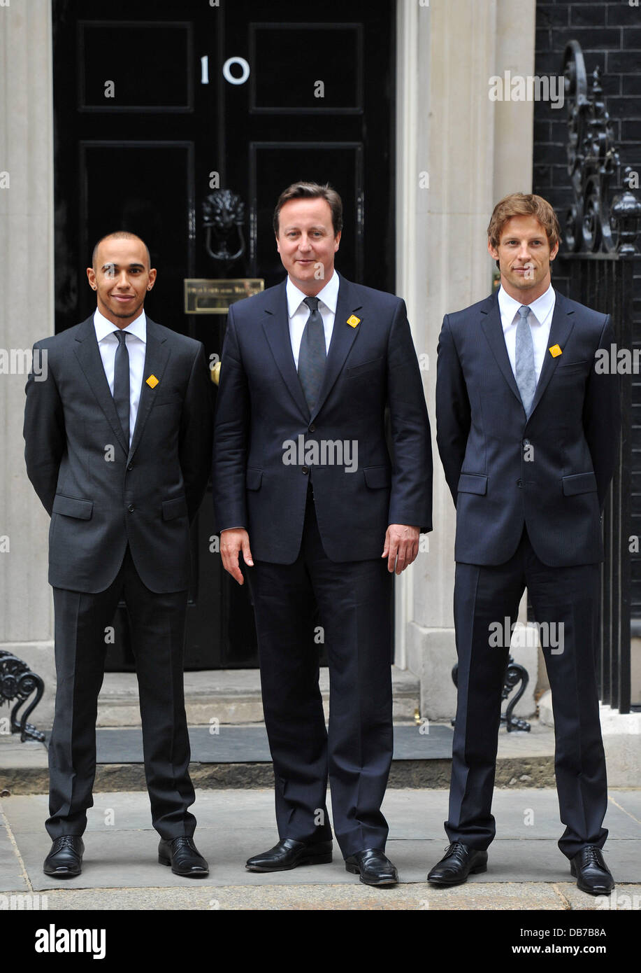 Prime Minister David Cameron, Jenson Button and Lewis Hamilton are ...
