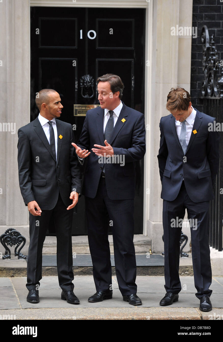 Prime Minister David Cameron, Jenson Button and Lewis Hamilton are ...
