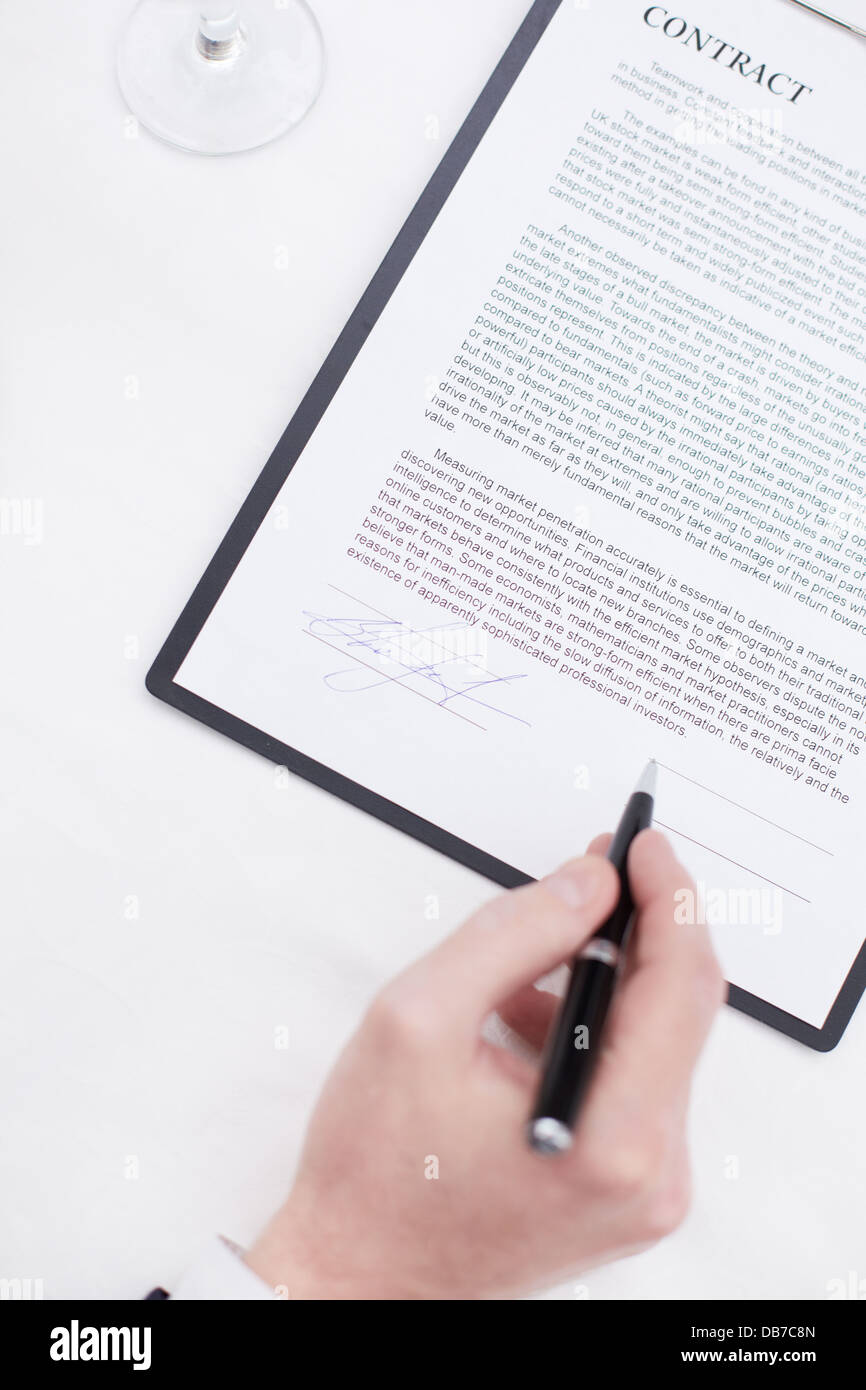 Image of businessman hand with pen signing contract Stock Photo - Alamy