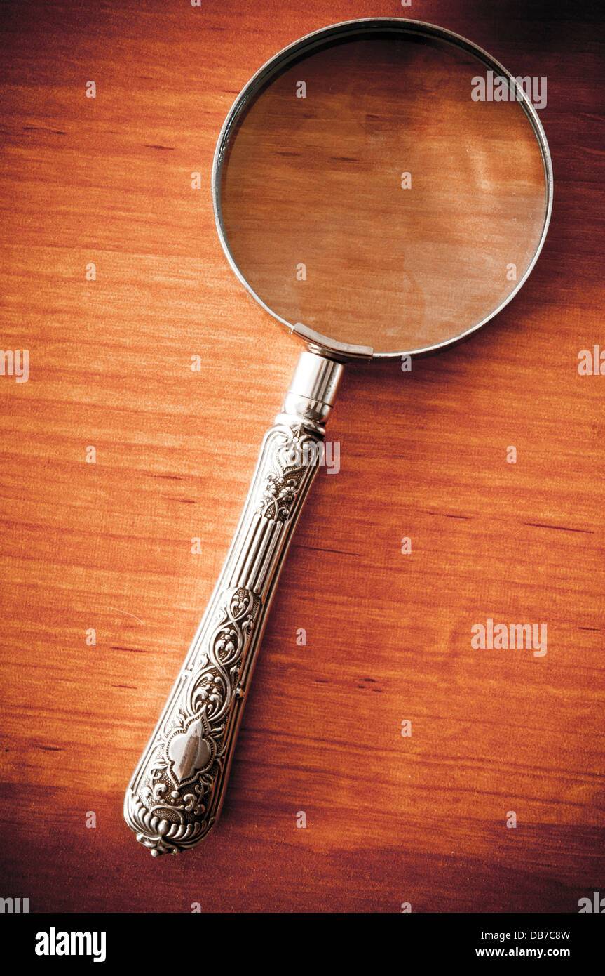 vintage silver magnifying glass Stock Photo - Alamy
