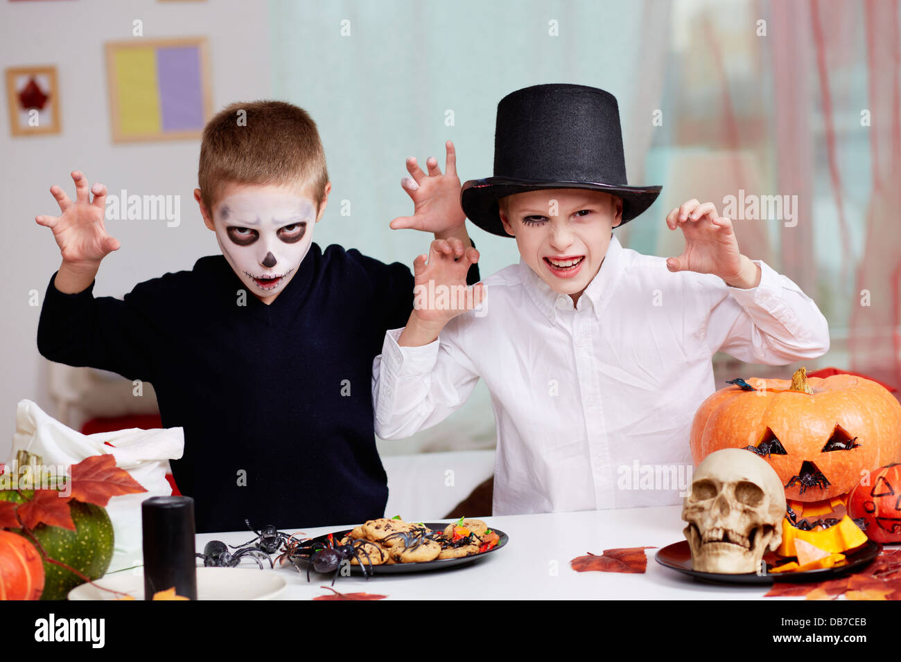 Photo of twin eerie boys looking at camera with frightening look Stock ...