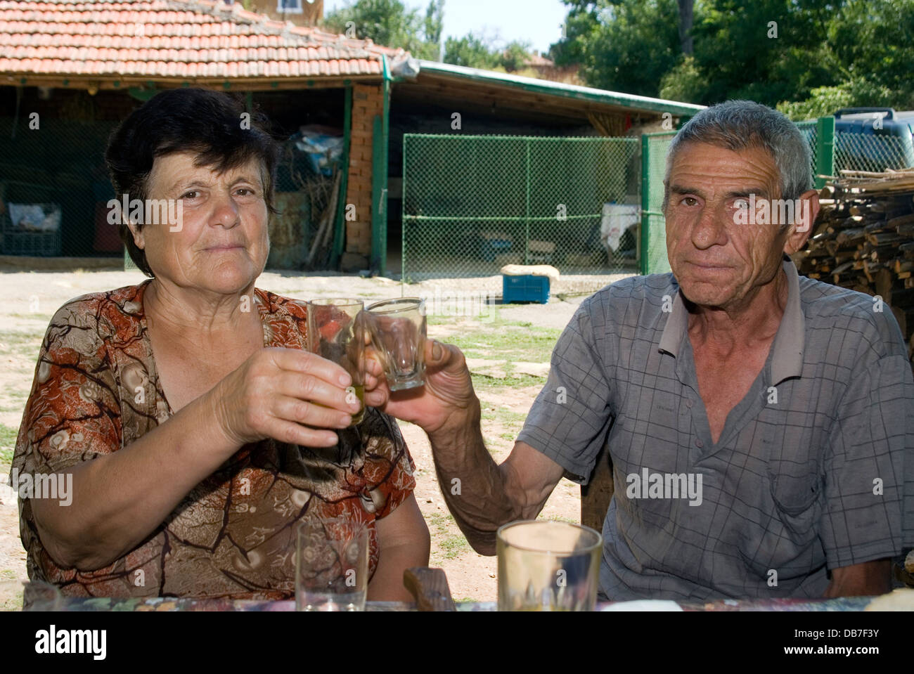 Bulgaria family enjoying a meal out side the home in a rural village ...
