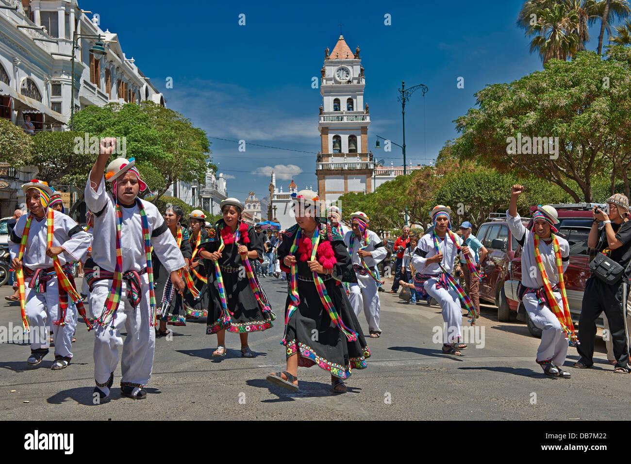 indigenous people with traditional costumes dancing in the street of ...