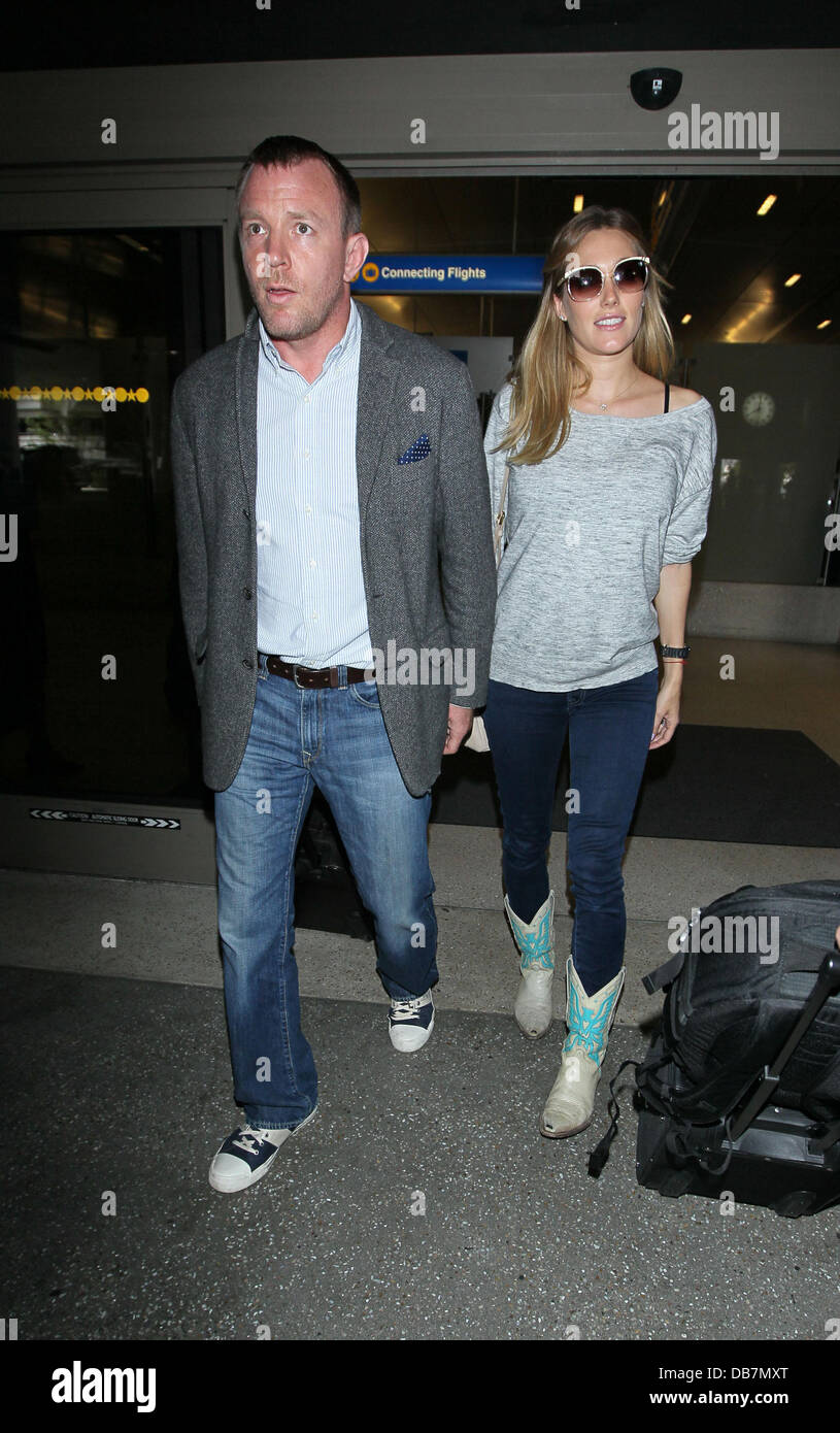 Guy Ritchie and his pregnant girlfriend Jacqui Ainsley arrive at LAX on ...