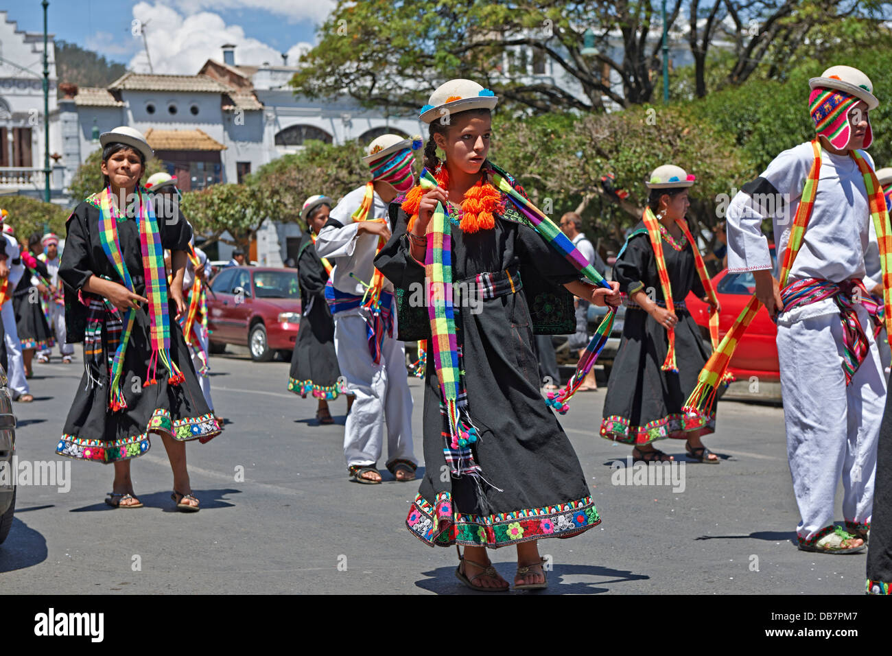 indigenous people with traditional costumes dancing in the street of ...
