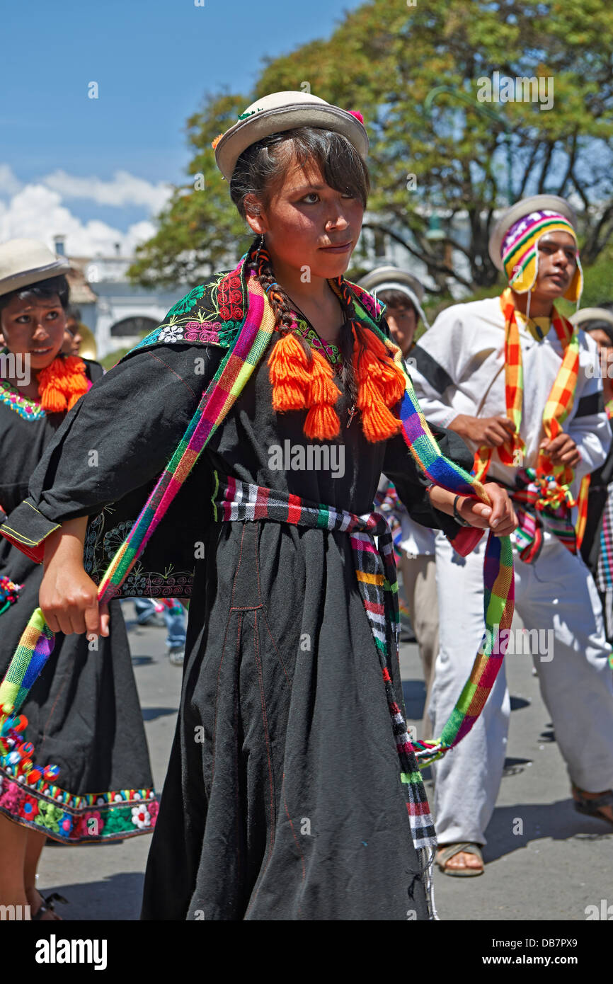 indigenous people with traditional costumes dancing in the street of ...