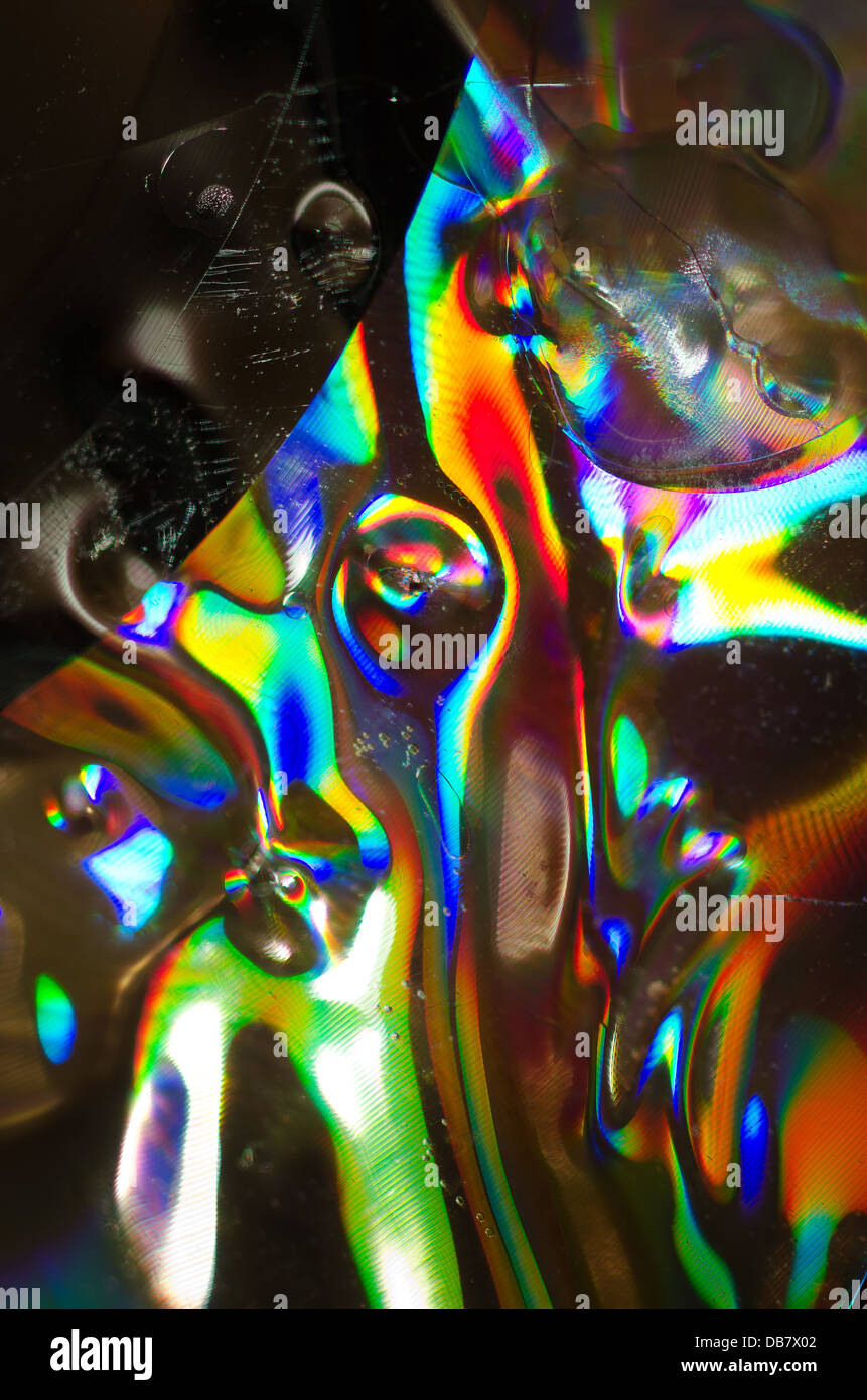 spectrum of colours reflections warped silver gold metal and plastic ...