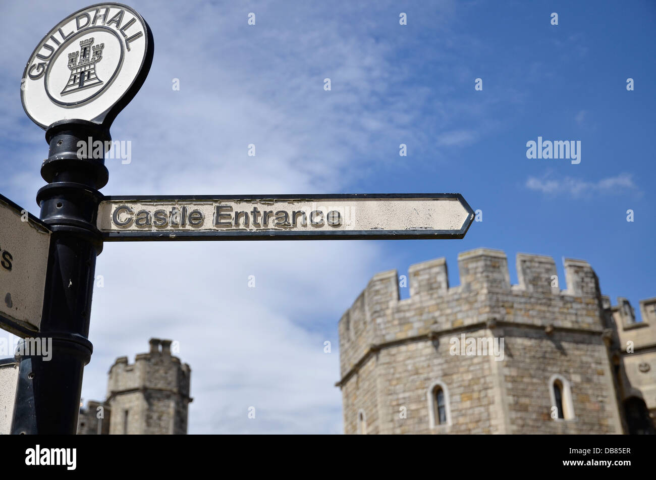 A sign showing the entrance to Windsor Castle, with the Castle in the ...