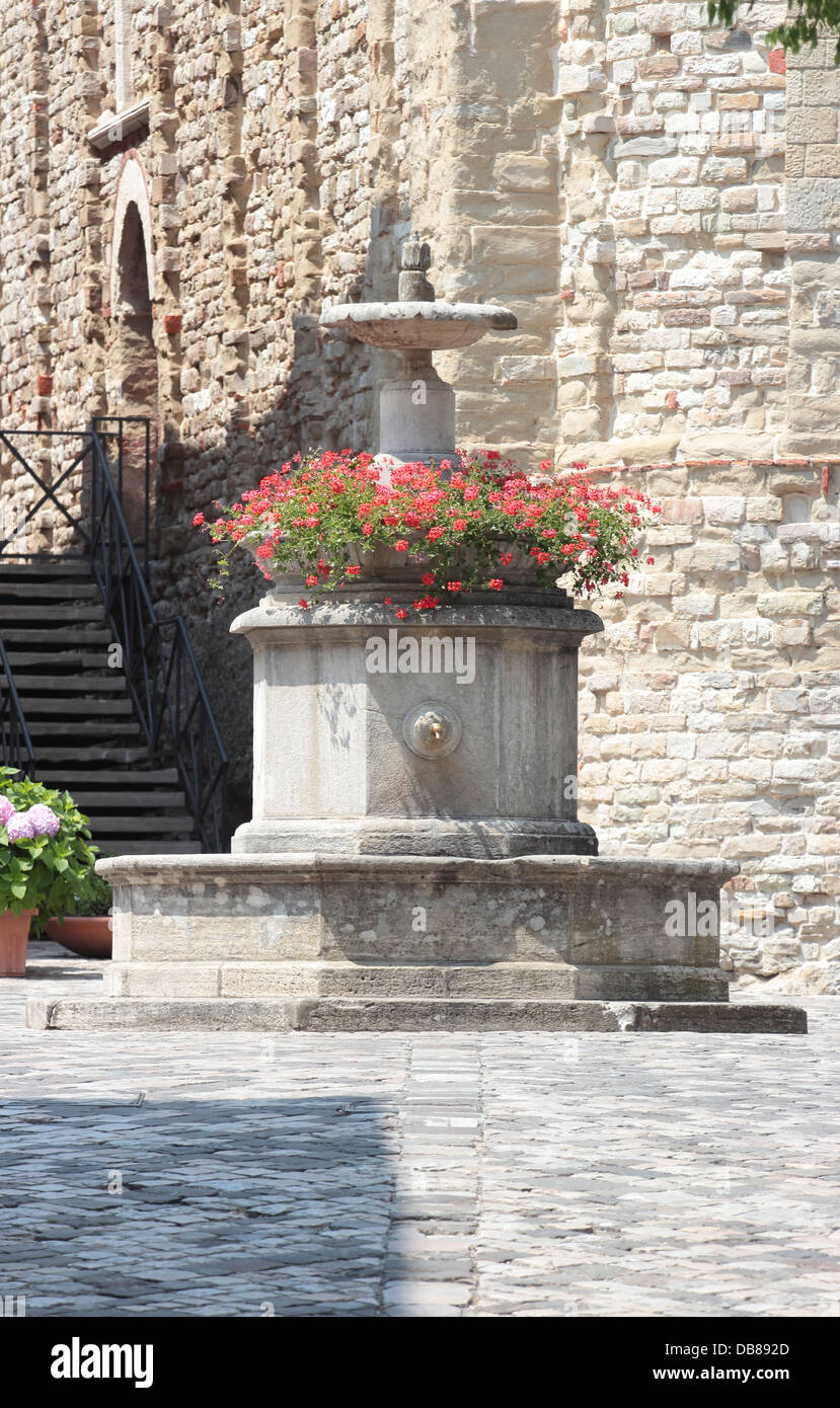 medieval fountain in the old town of San Leo, Italy Stock Photo - Alamy
