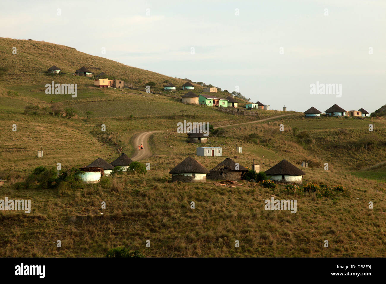 traditional thatch and mud huts on the hillside in the village of ...