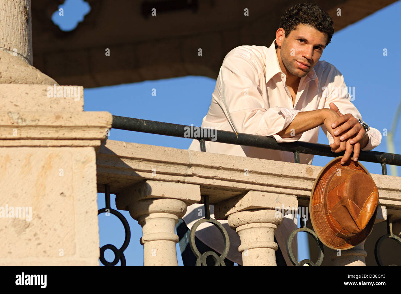 Man leaning on balcony hi-res stock photography and images - Alamy